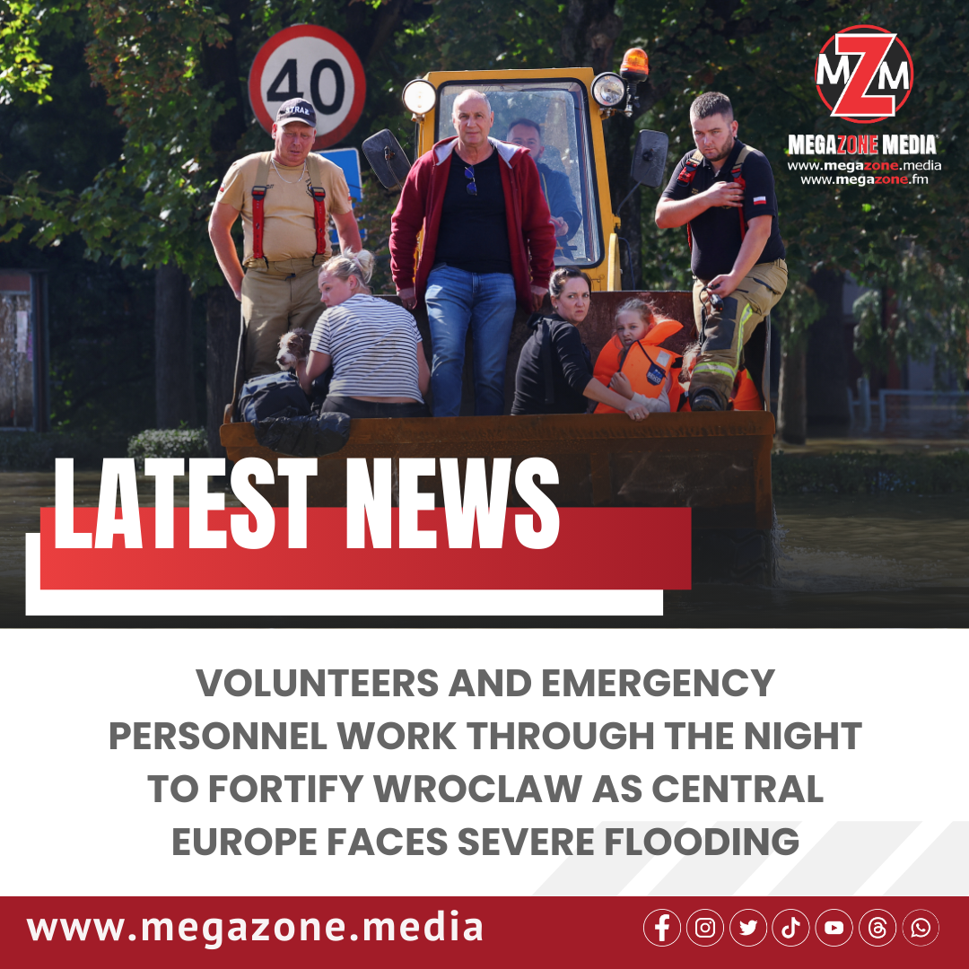Volunteers and Emergency Personnel Work Through the Night to Fortify ...